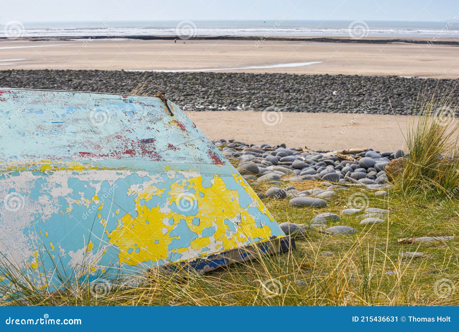 An Upturned Small Boat Washed Up on the Shoreline of a Beautiful ...