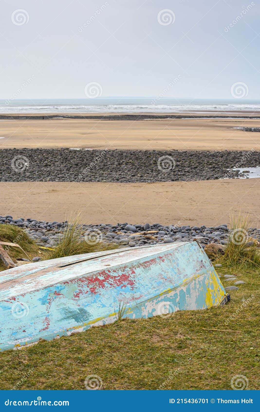 An Upturned Small Boat Washed Up on the Shoreline of a Beautiful ...