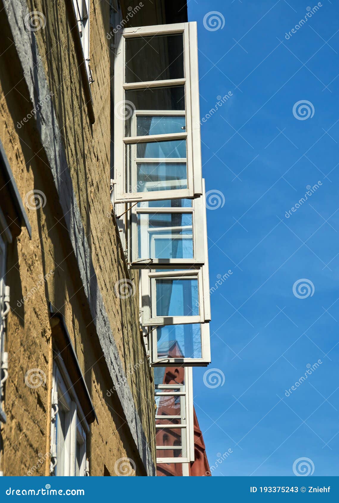 Upward View Along a House Wall with Open Windows with White Painted ...