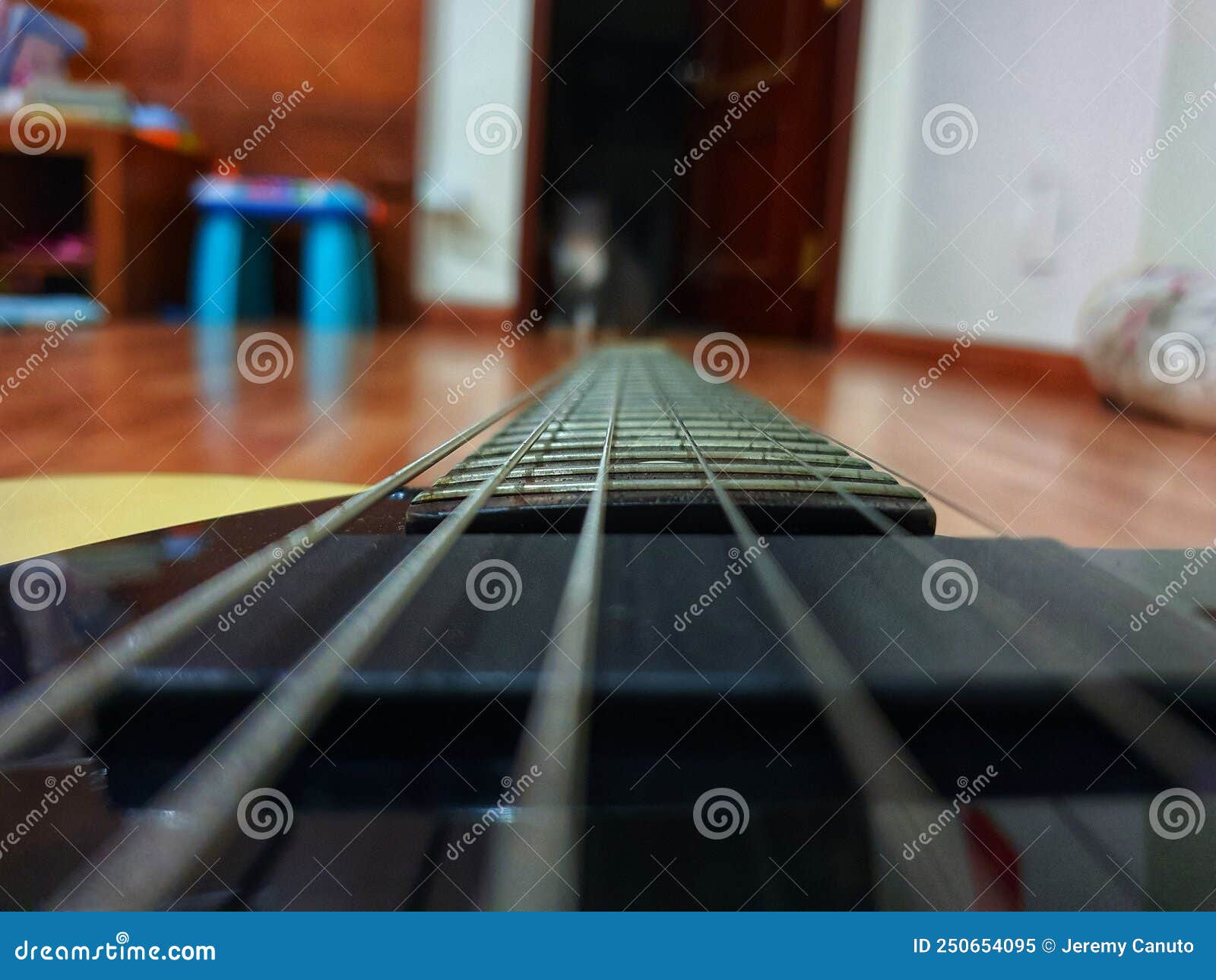 Upward view of guitar neck stock image. Image of room - 250654095