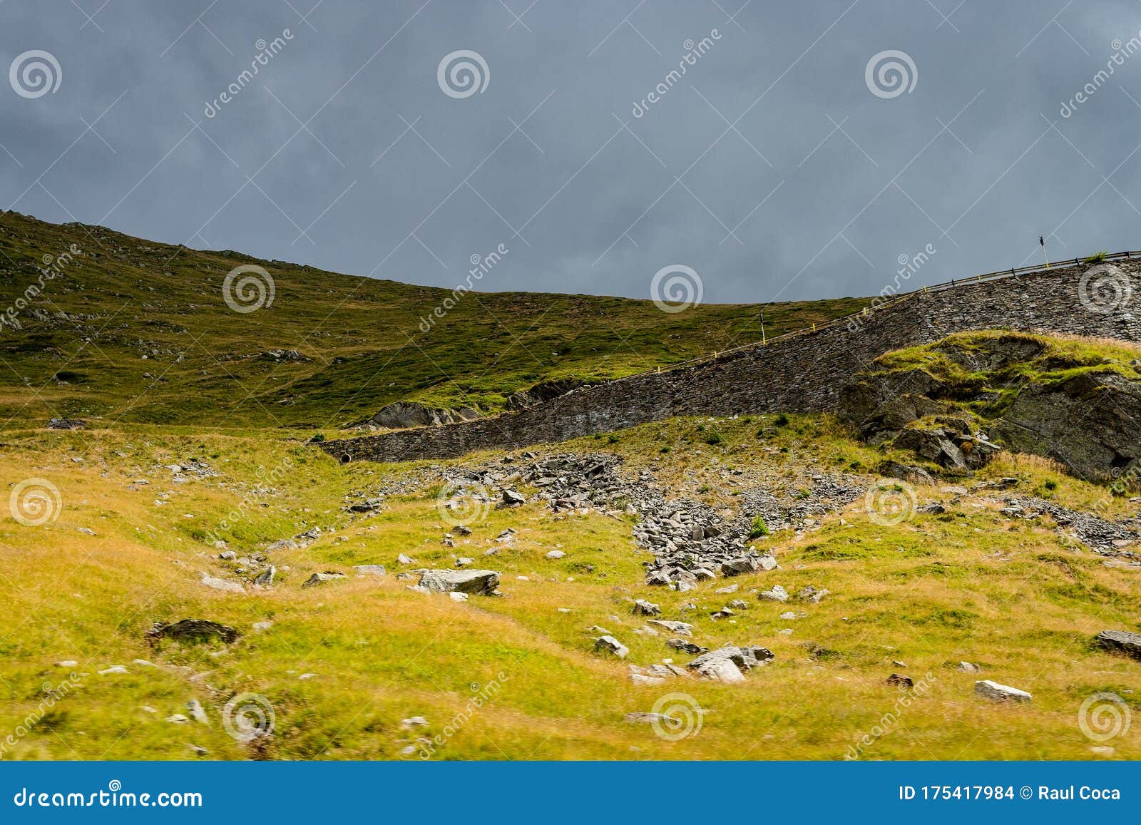 Upwards View of a Mountain Road Railing with Fallen Rocks in the ...