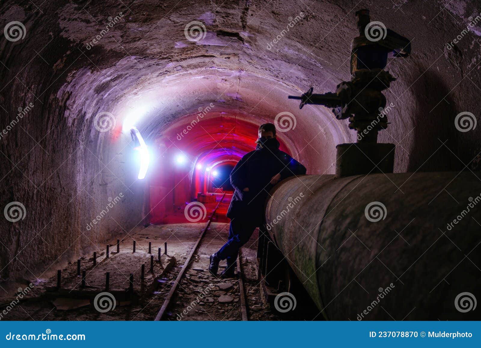 Urban Explorer in Mask in Underground Communication Tunnel Editorial ...