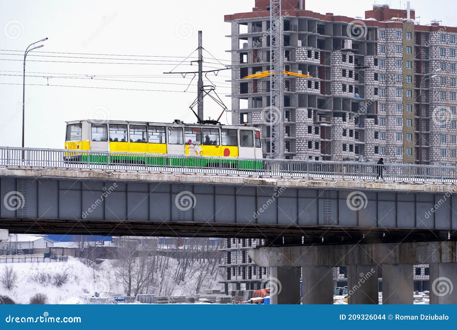 Urban Landscape. a Tram Goes through the Area of New Construction on ...