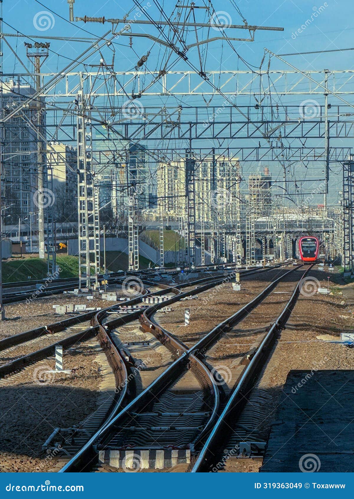 Urban Railway with Multiple Tracks and Approaching Red Train Stock ...