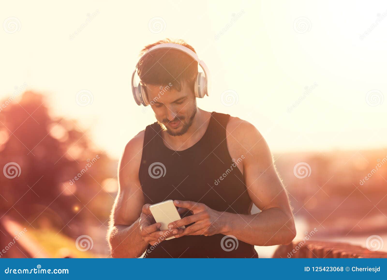 Urban Runner Using Smartphone for Training Stock Photo - Image of ...