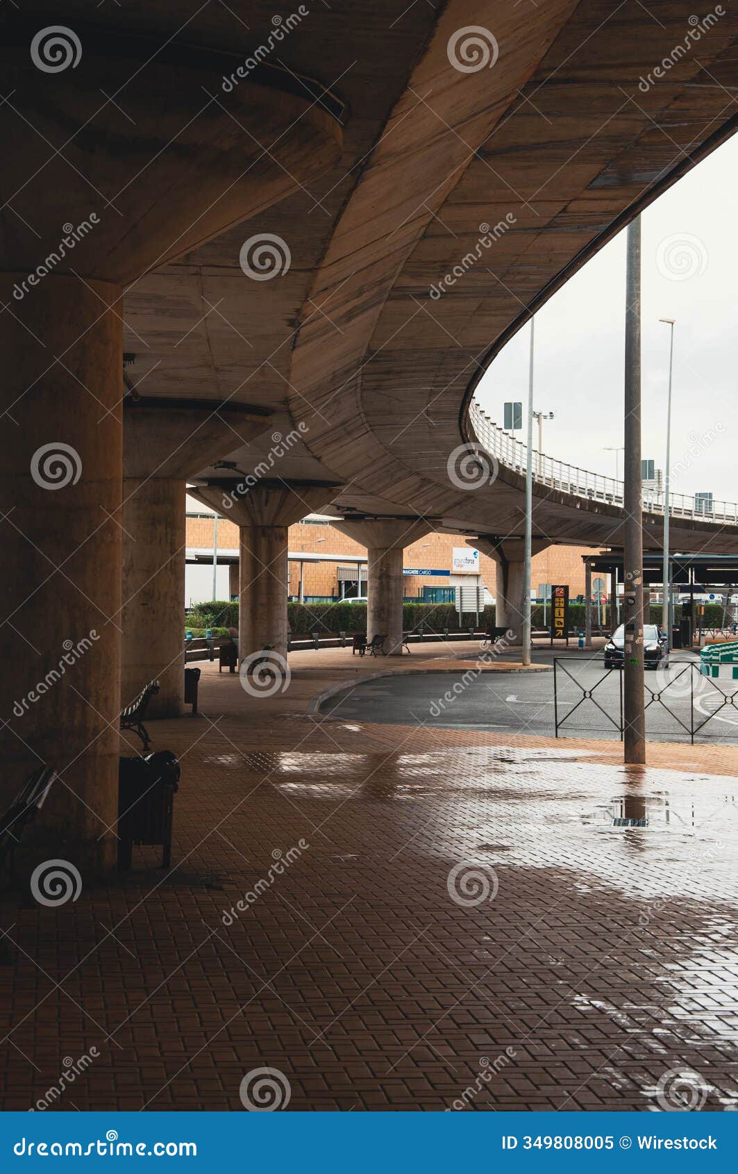 Urban Underpass with Wet Pavement and Concrete Structure. Editorial ...