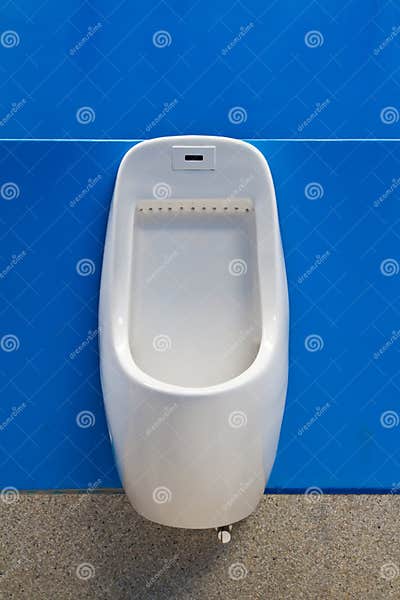 Urinal on blue wall stock photo. Image of design, latrine - 24276902