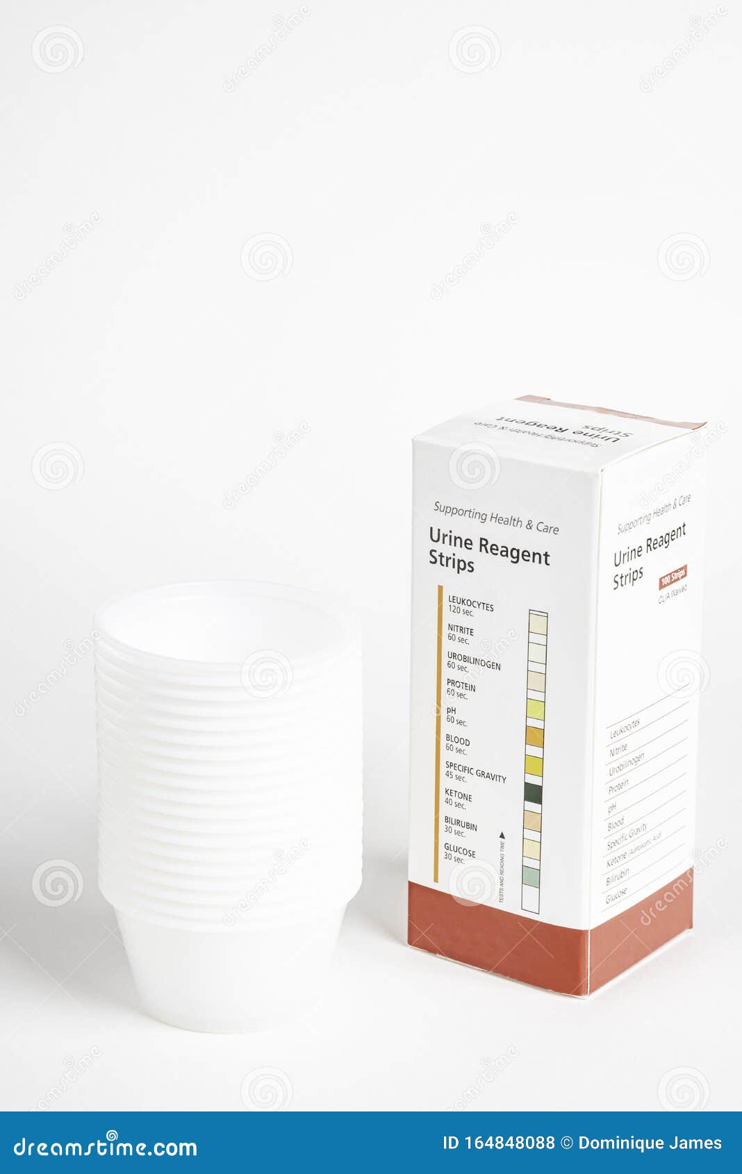 Urine Strips Box and a Stack of Plastic Containers Stock Photo - Image ...