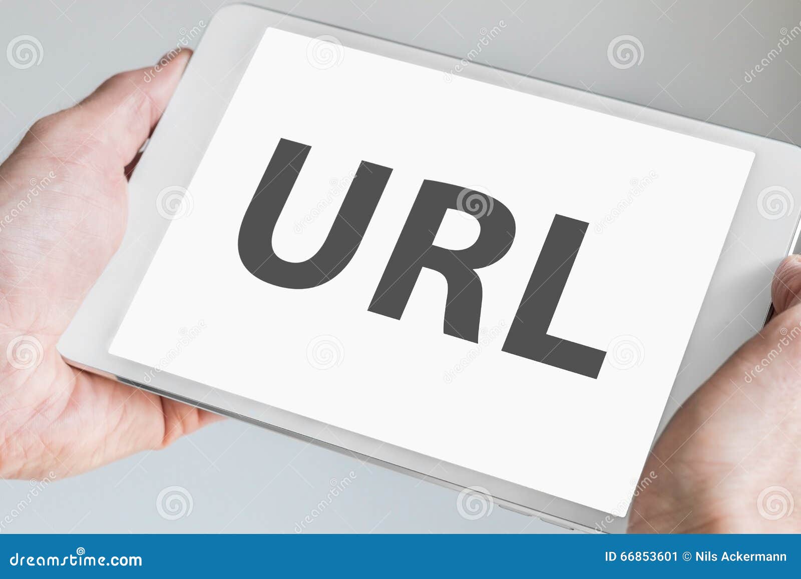 URL Text Displayed on Touch Screen of Modern Tablet. Hands Holding ...