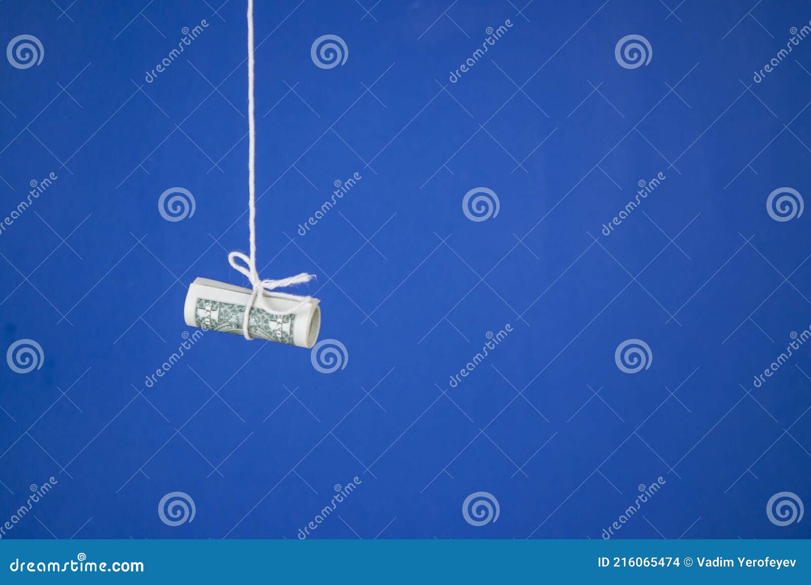 US Dollar Banknotes Hanging on Rope Against Blue Wall Background Stock ...