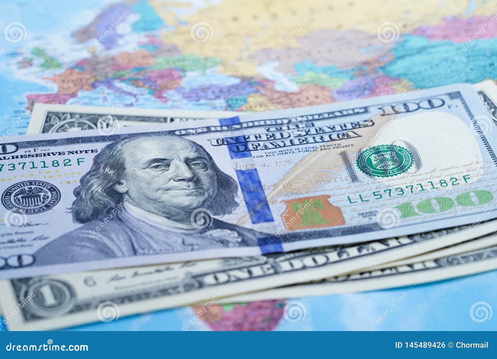 US Dollar Banknotes on World Globe Map Background. Stock Photo - Image ...