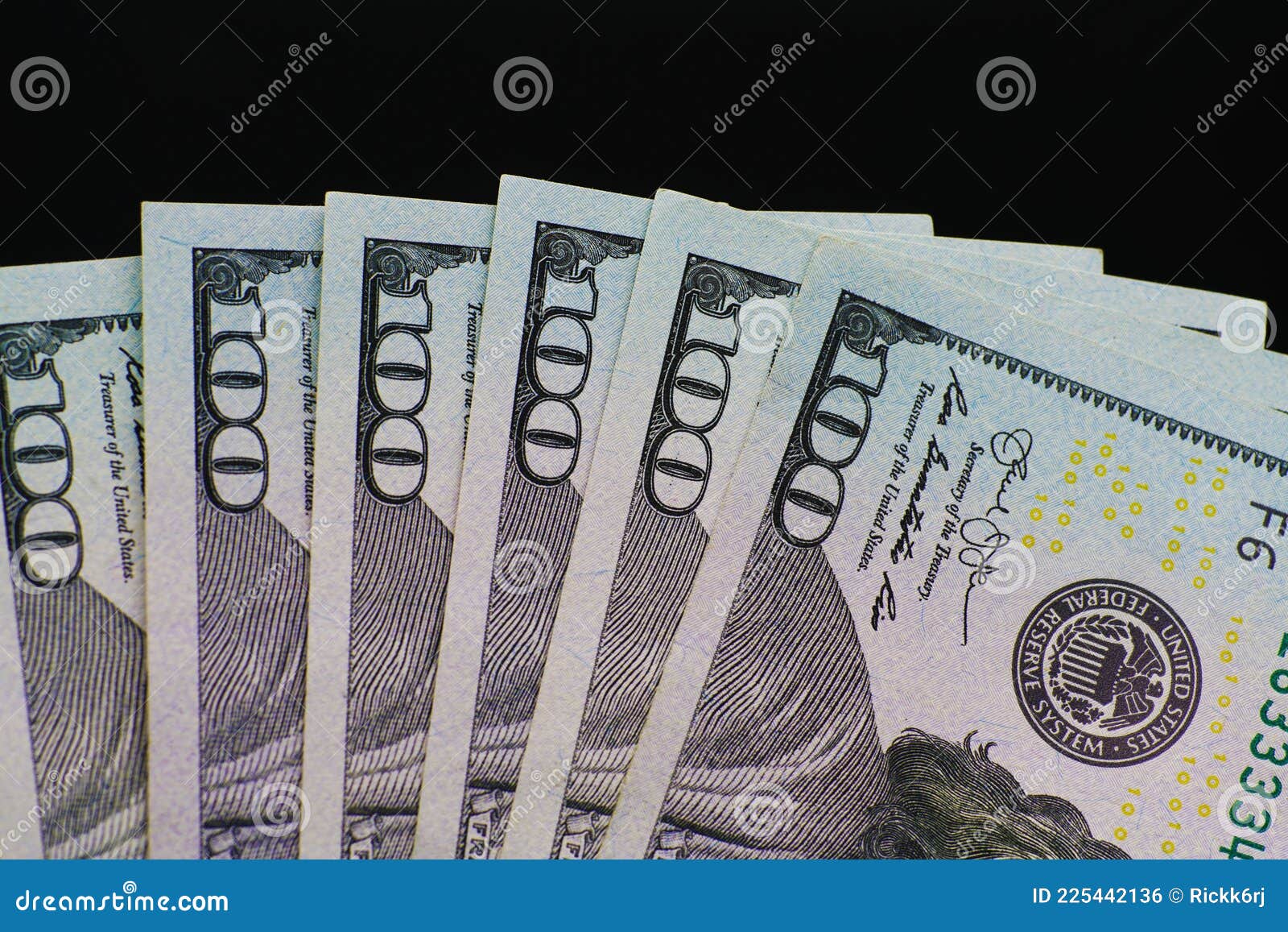 US 100 Dollar Notes Fanned Out on Black Background. Stock Photo - Image ...