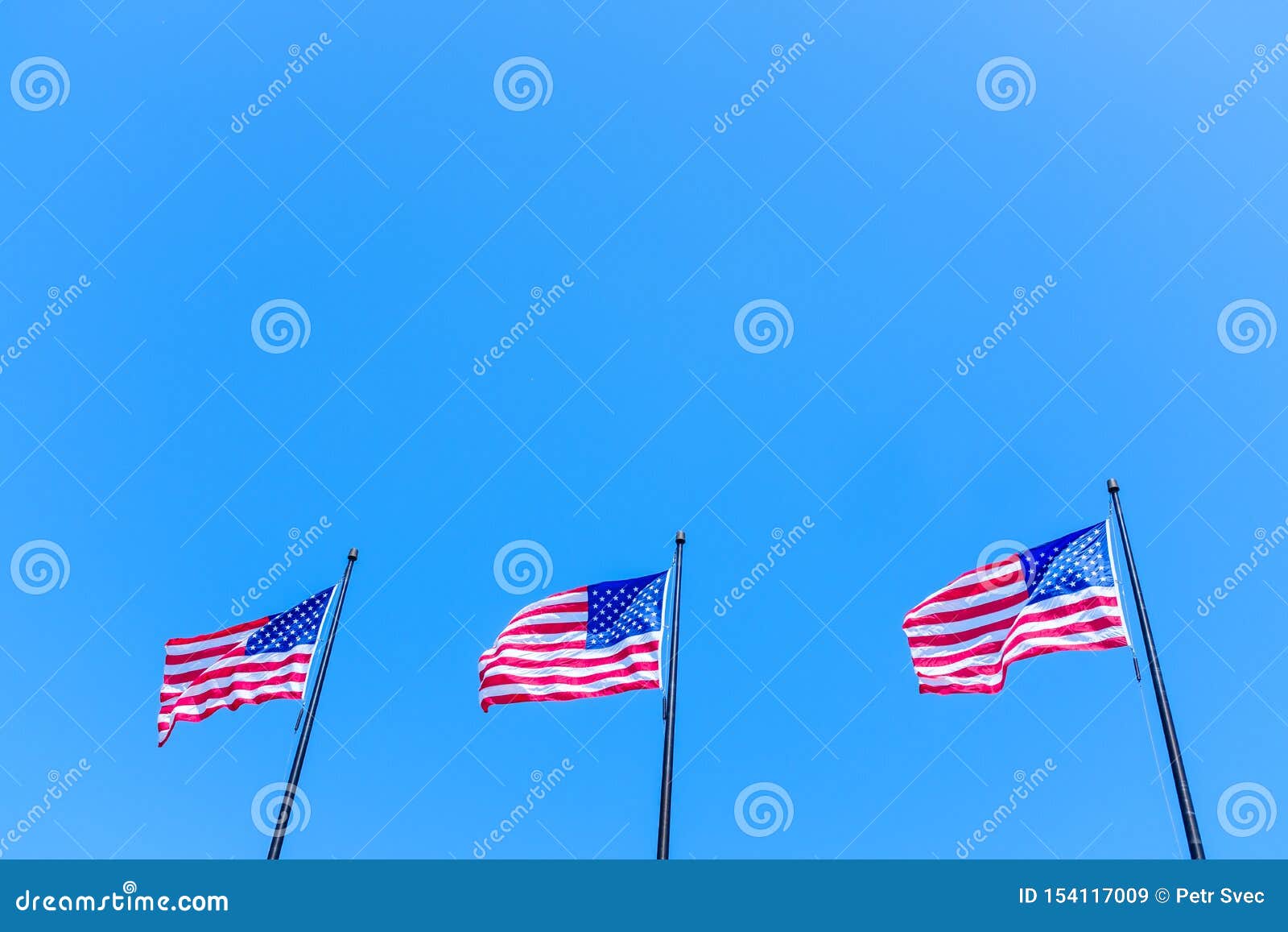US flags on tall poles stock image. Image of united - 154117009