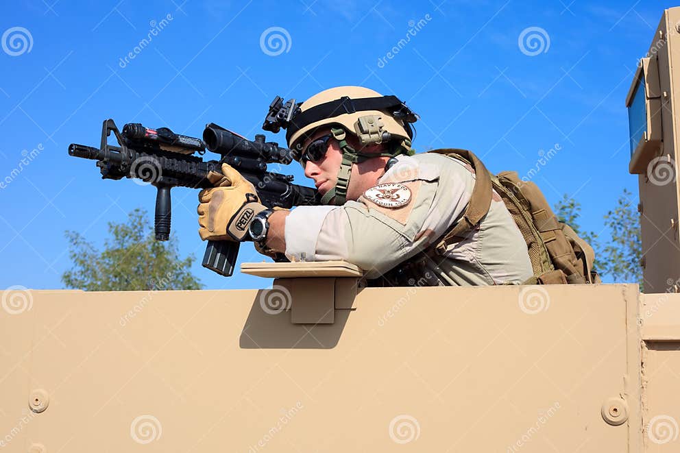 US Navy EOD Aims Rifle from Humvee Editorial Stock Photo - Image of ...