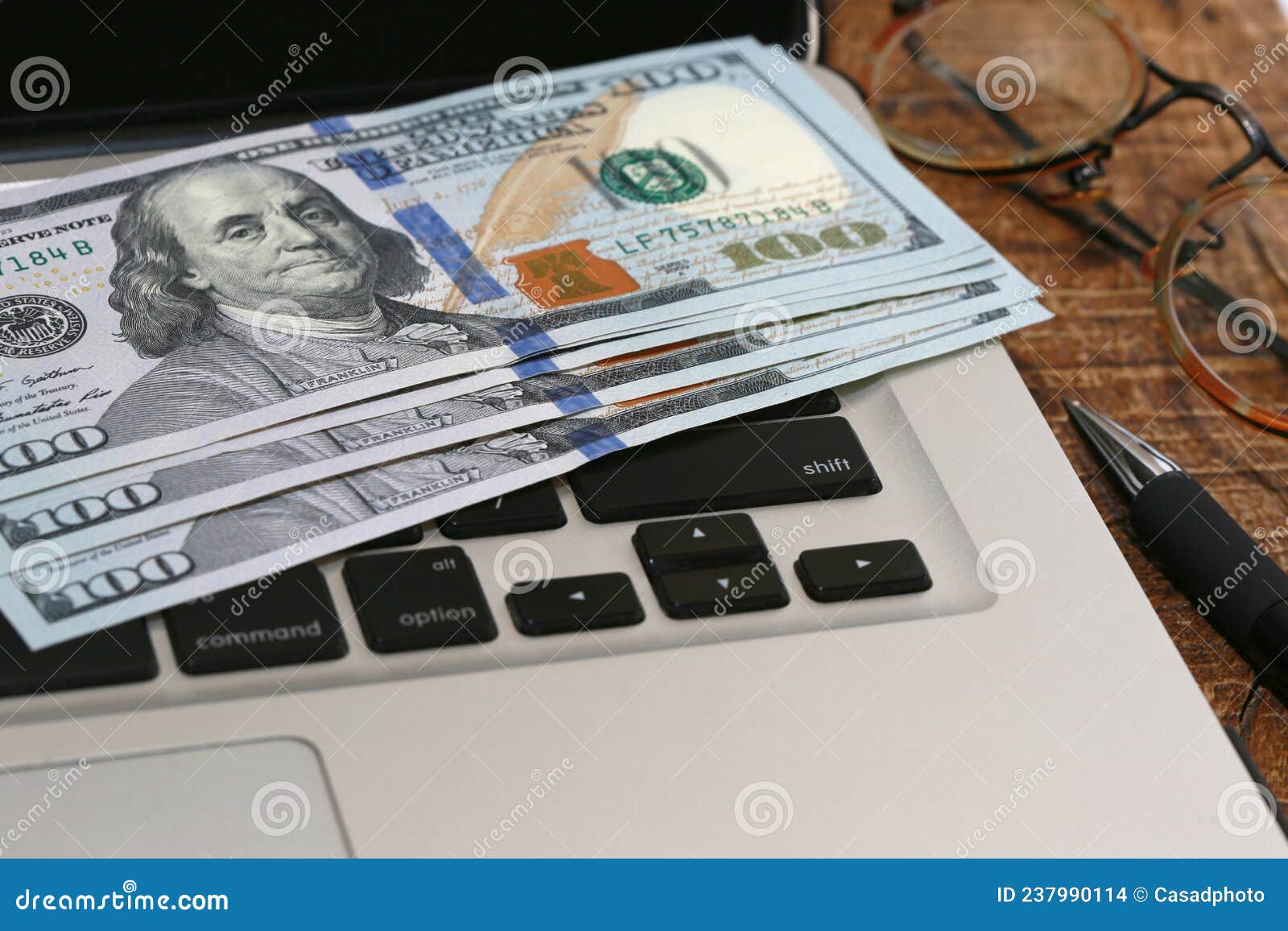 Money on computer keyboard stock photo. Image of internet - 237990114