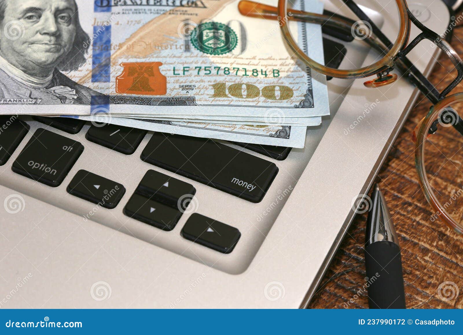 Money on computer keyboard stock photo. Image of sale - 237990172