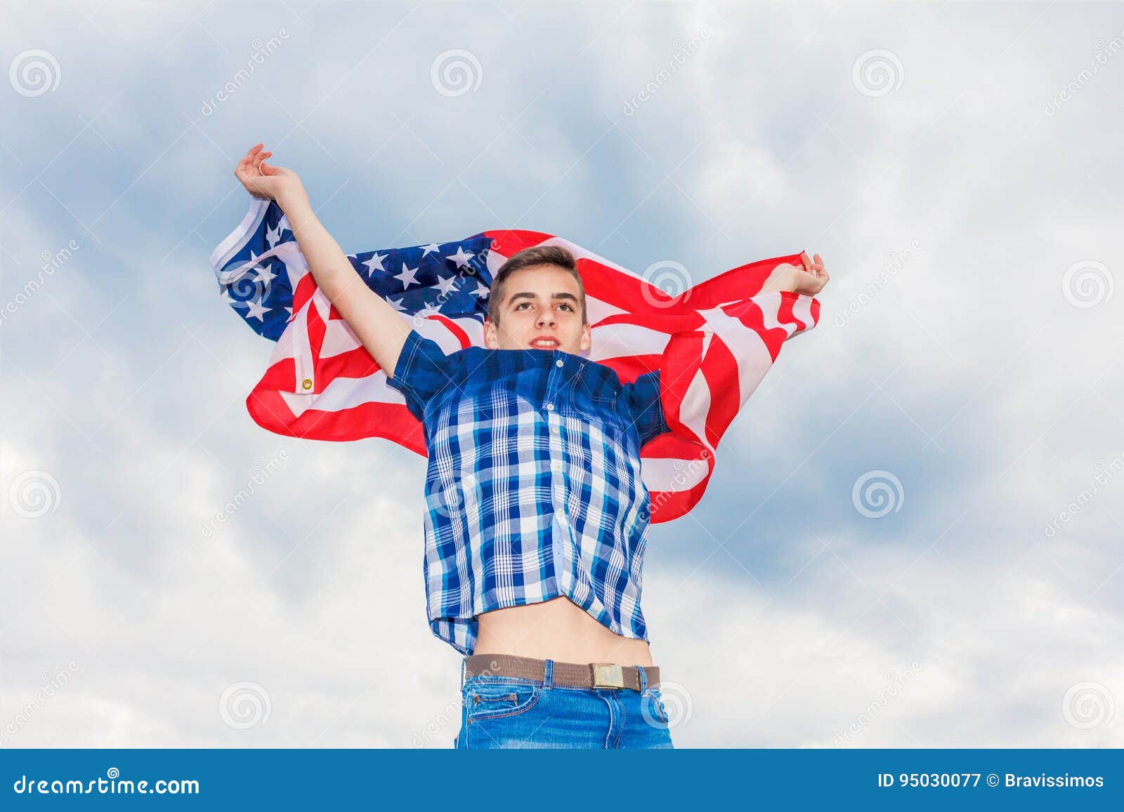 USA Flag is Held by a Running Guy in the Background of a Summer Sky ...