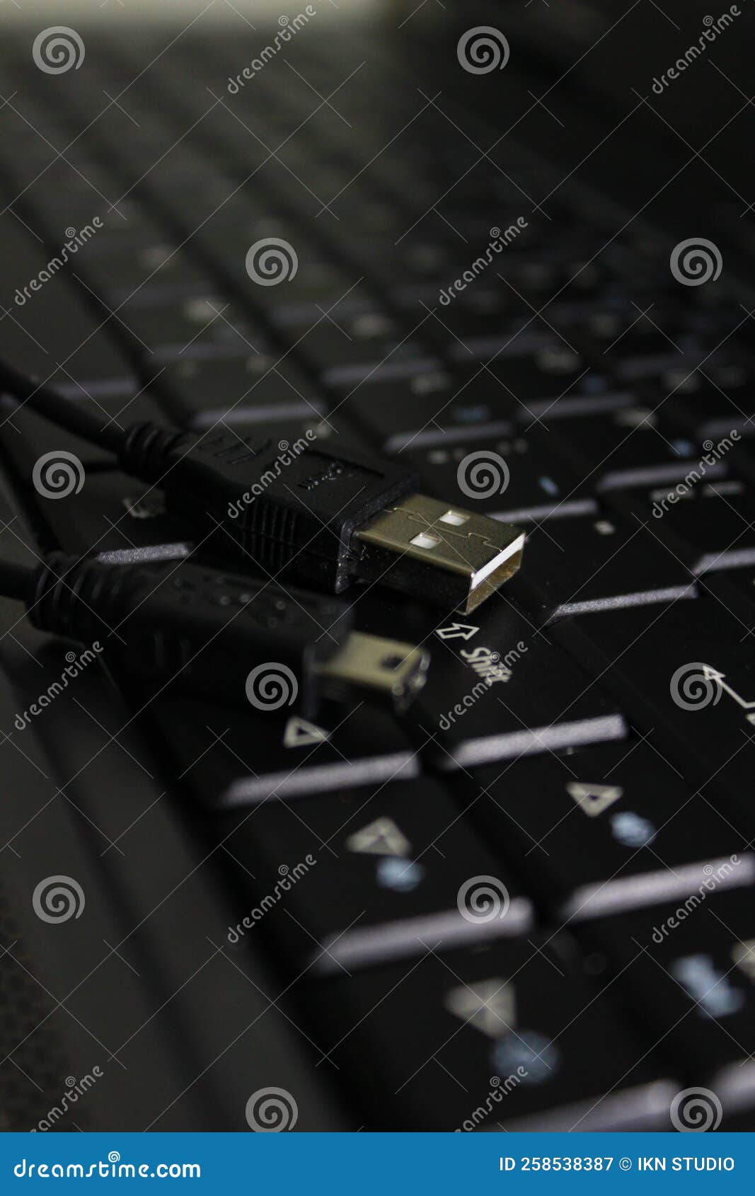 The Usb Cable Above the Black Laptop Keyboard Stock Image - Image of ...