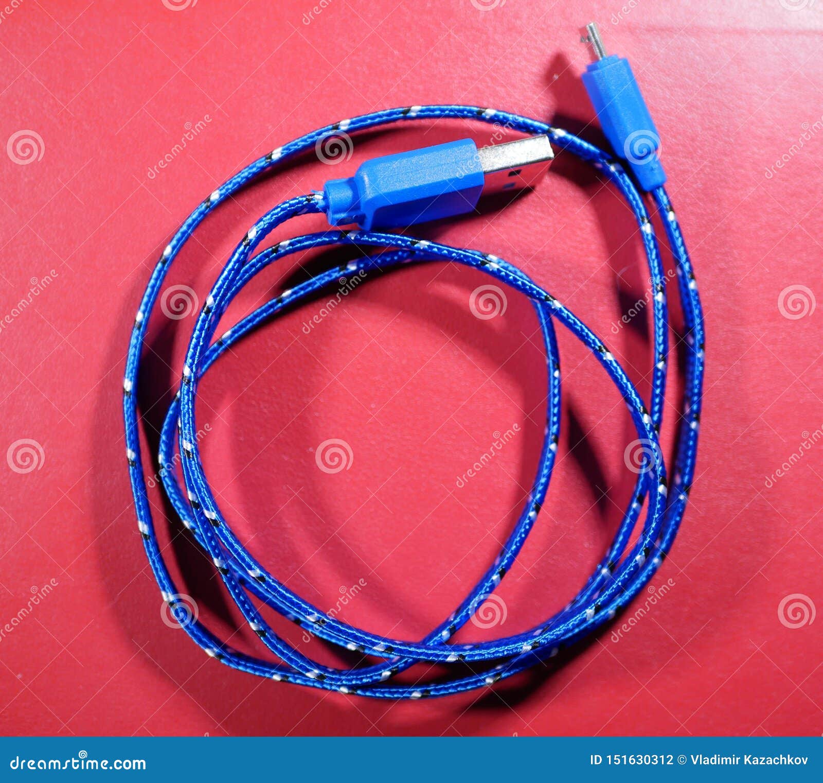 USB Cable in Blue Braid with White Dots on Red Background. Stock Photo ...