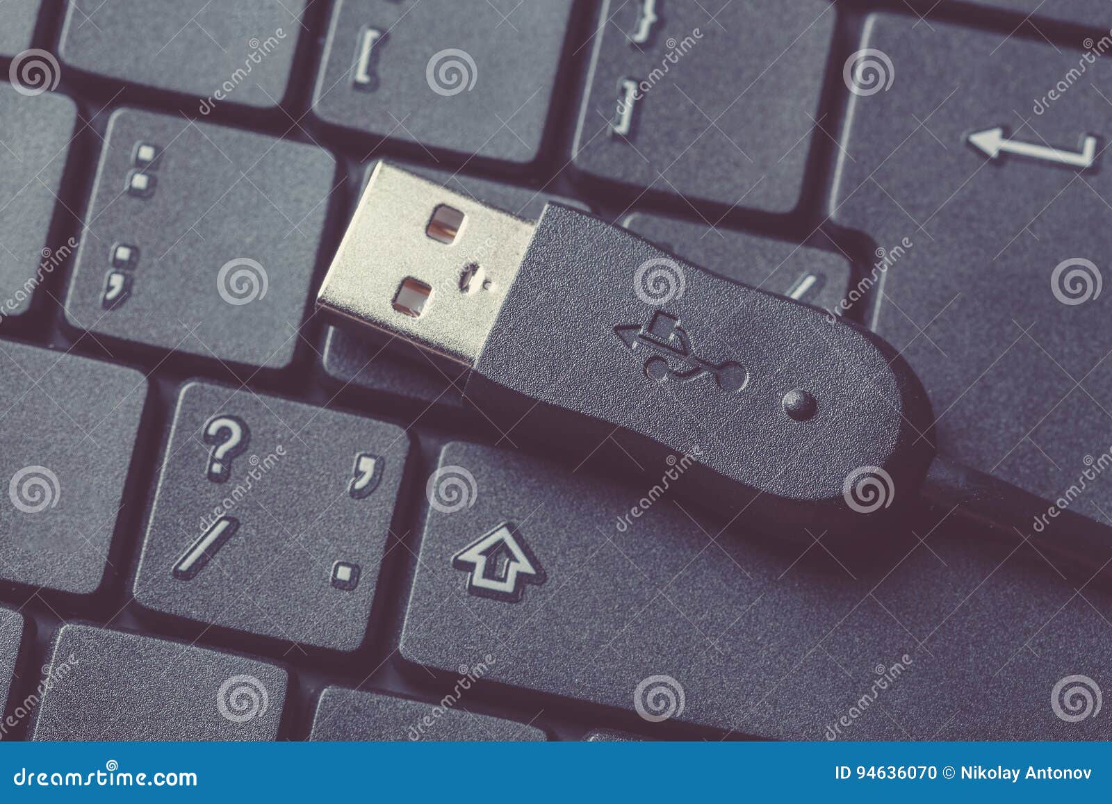 Usb Cable Connector on a Black Laptop Keyboard Close Up. Toned Image ...