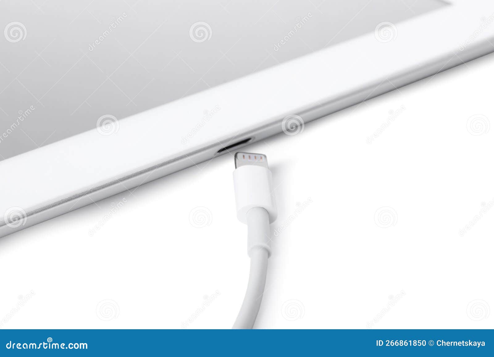 USB Cable with Lightning Connector and Tablet on White Background Stock ...