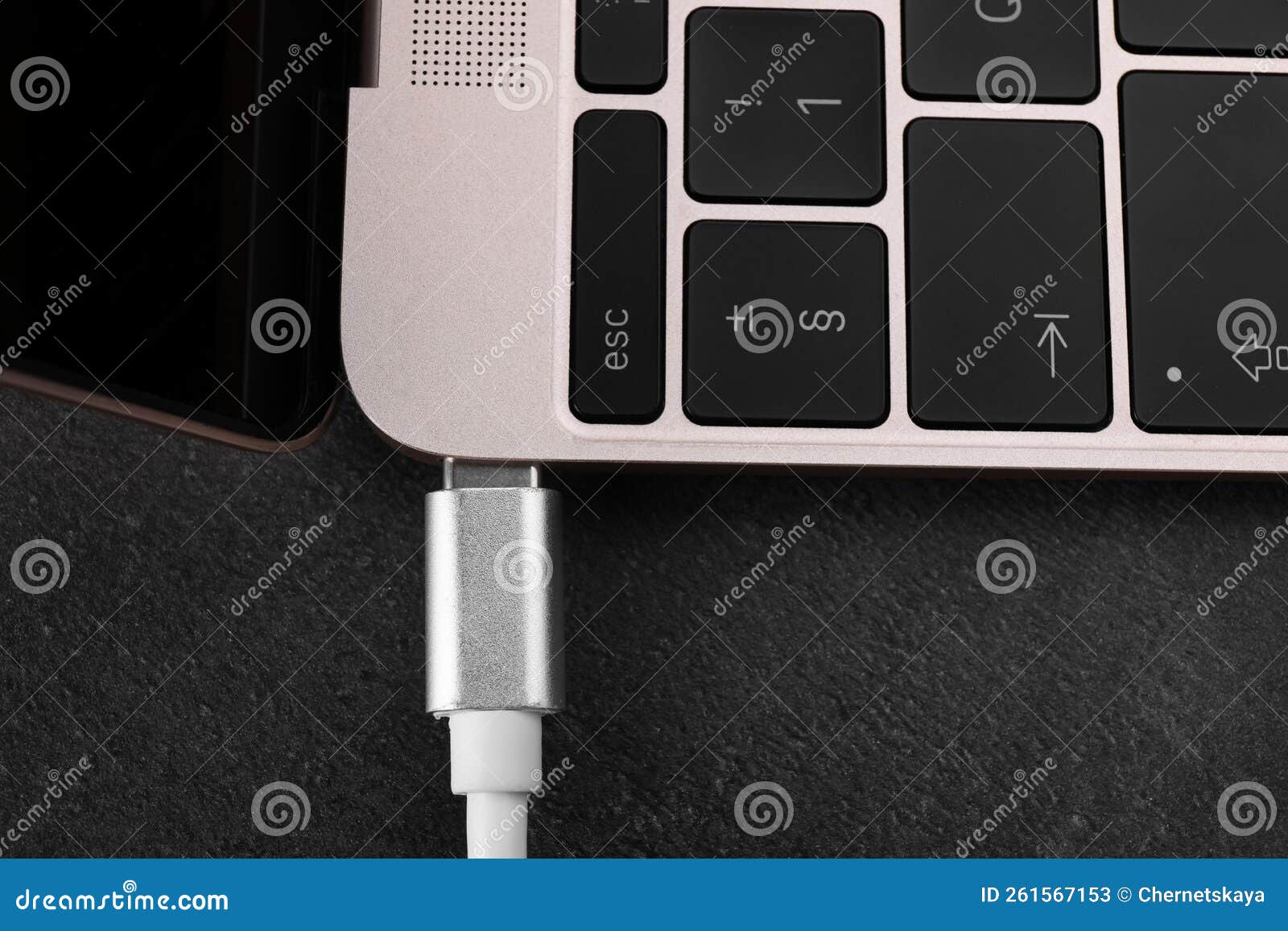 USB Cable Plugged into Laptop Port on Dark Table, Top View Stock Image ... USB Cable Plugged into Laptop Port on Dark Table, Top View Stock Image ...