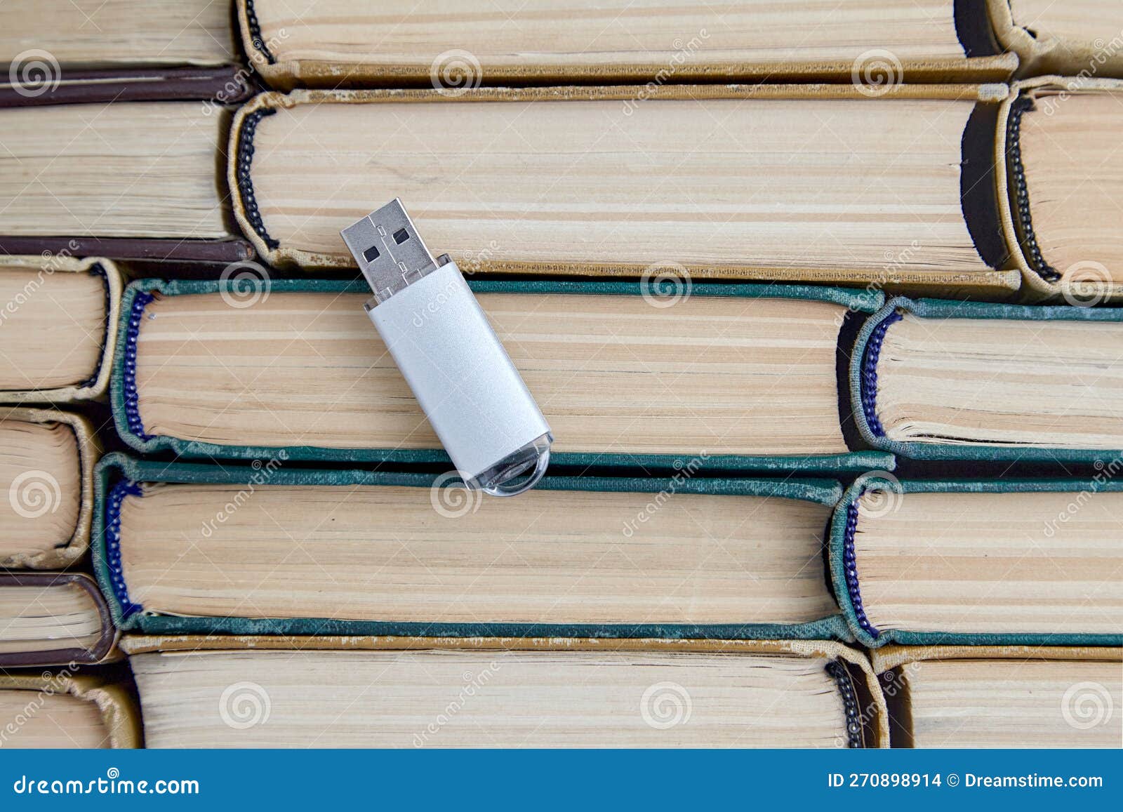 USB Flash Drive of a Computer on the Background of a Stack of Old Paper ...