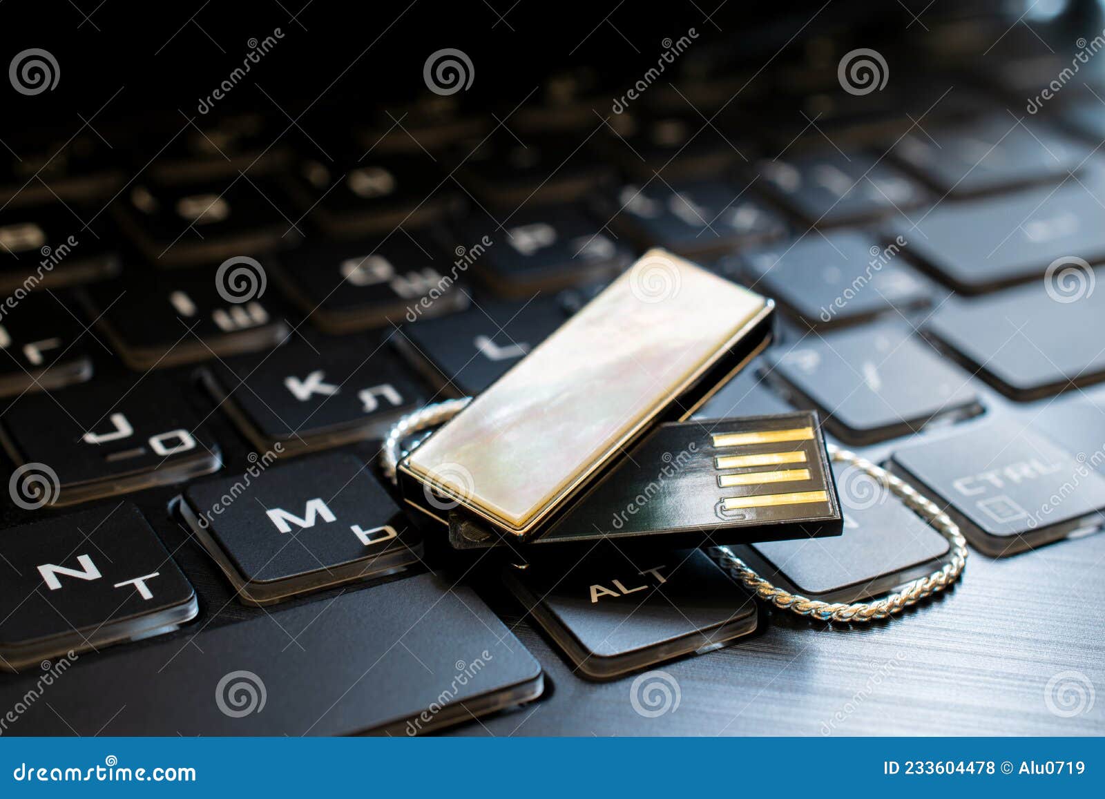 USB Flash Drive with Pearlescent Case on Laptop Keyboard Stock Photo ...