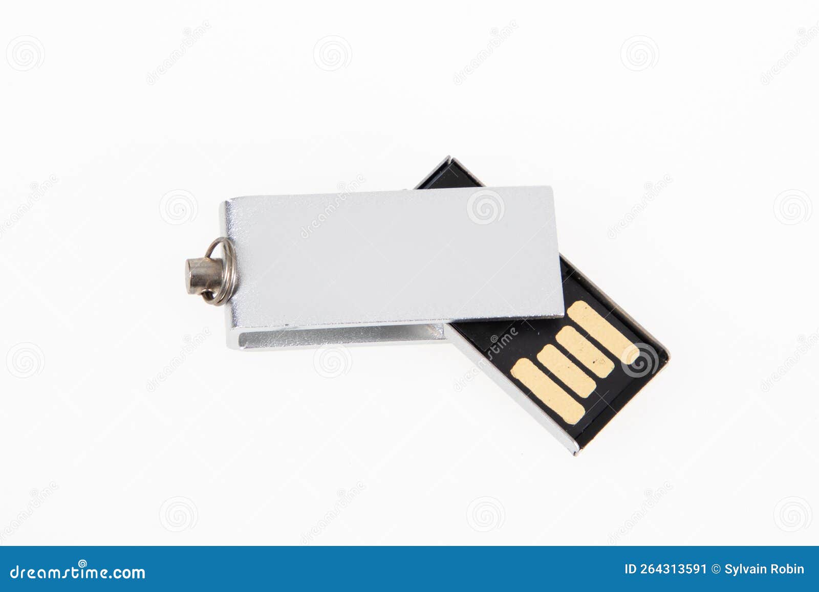 USB Key Silver Flash Drive Rotating Stick Memory on White Desk ...