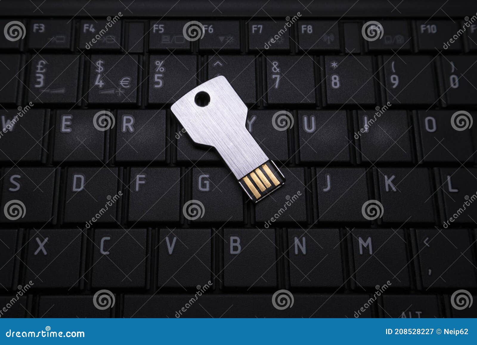 USB Memory in the Form of a Key on a Blurred Keyboard Background Stock ...