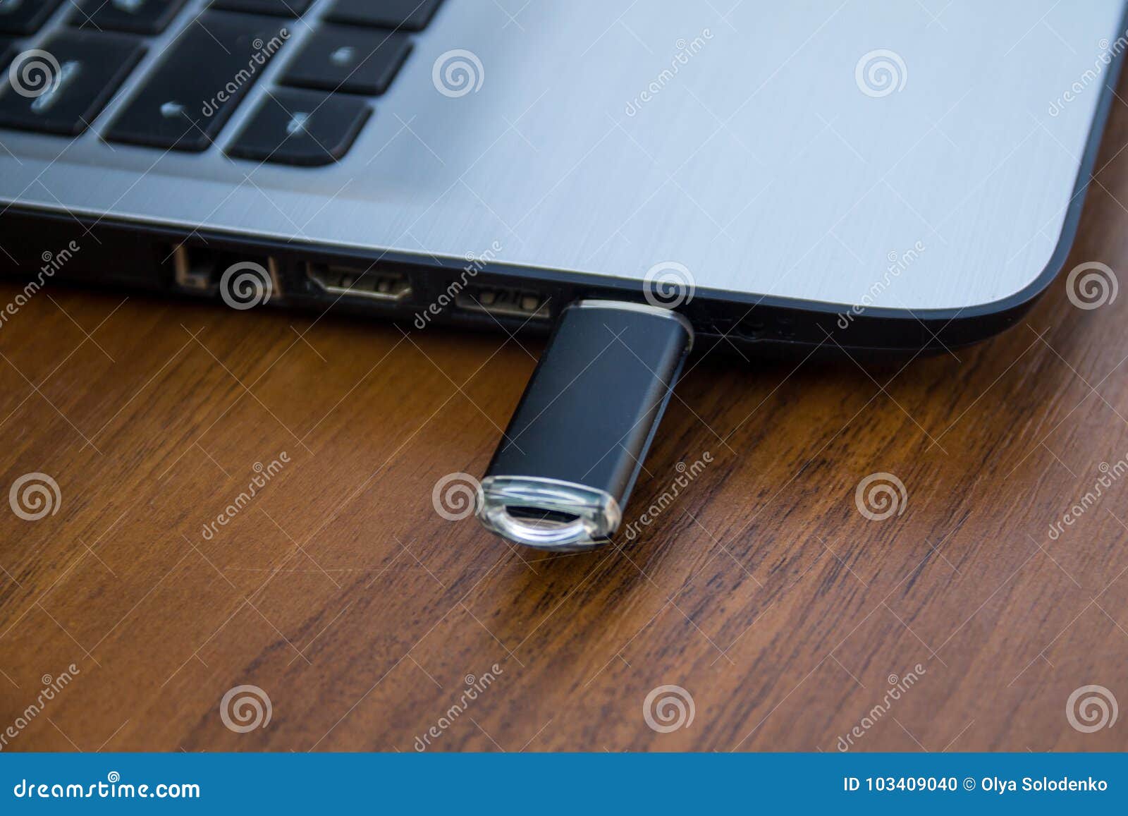 USB Memory Stick or Flash Drive Attached To the Side of a Laptop Stock ...
