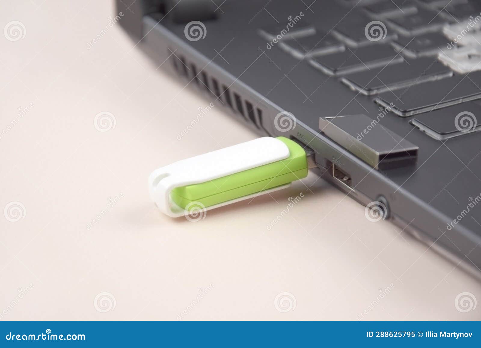 USB Memory Stick or Flash Drive on the Keyboard of an Open Laptop ...