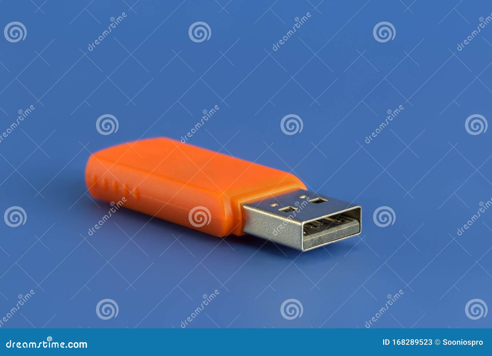 USB Memory Stick - Orange Flash Drive on a Blue Background Stock Image ...