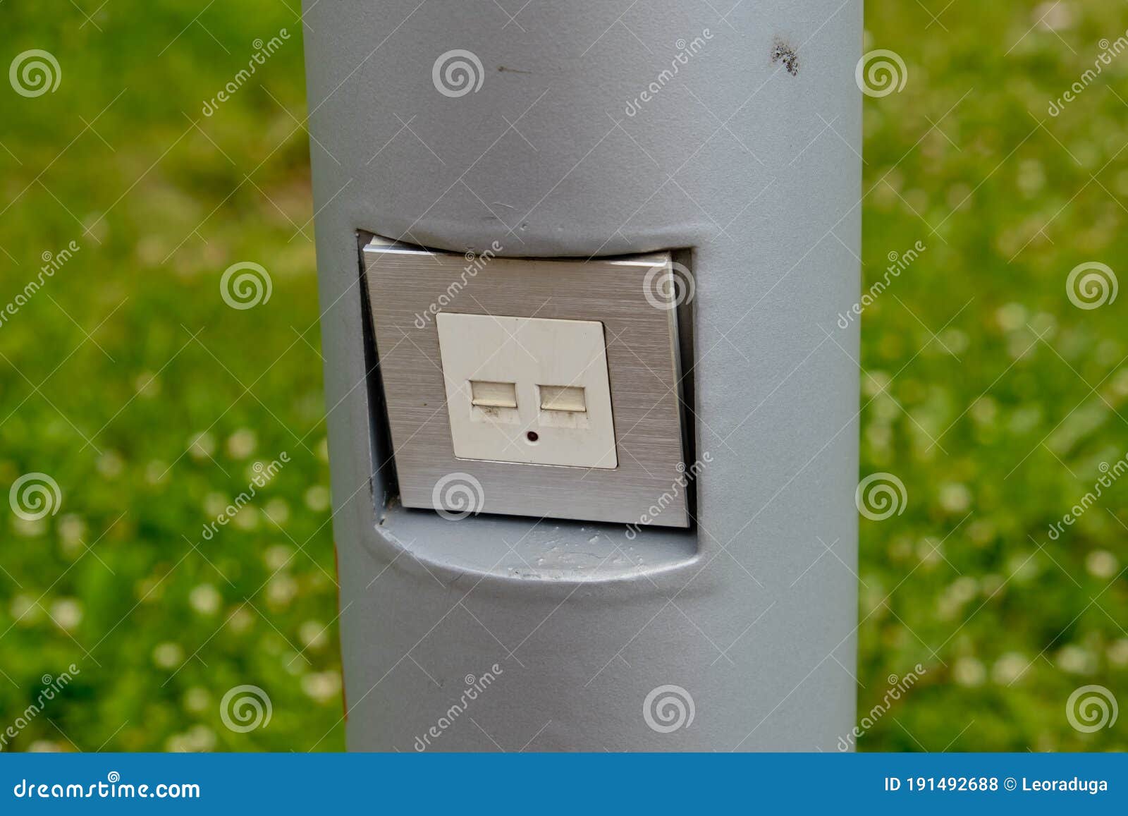 USB Socket for Charging Mobile Phones on a Pole in the Park. Stock ...