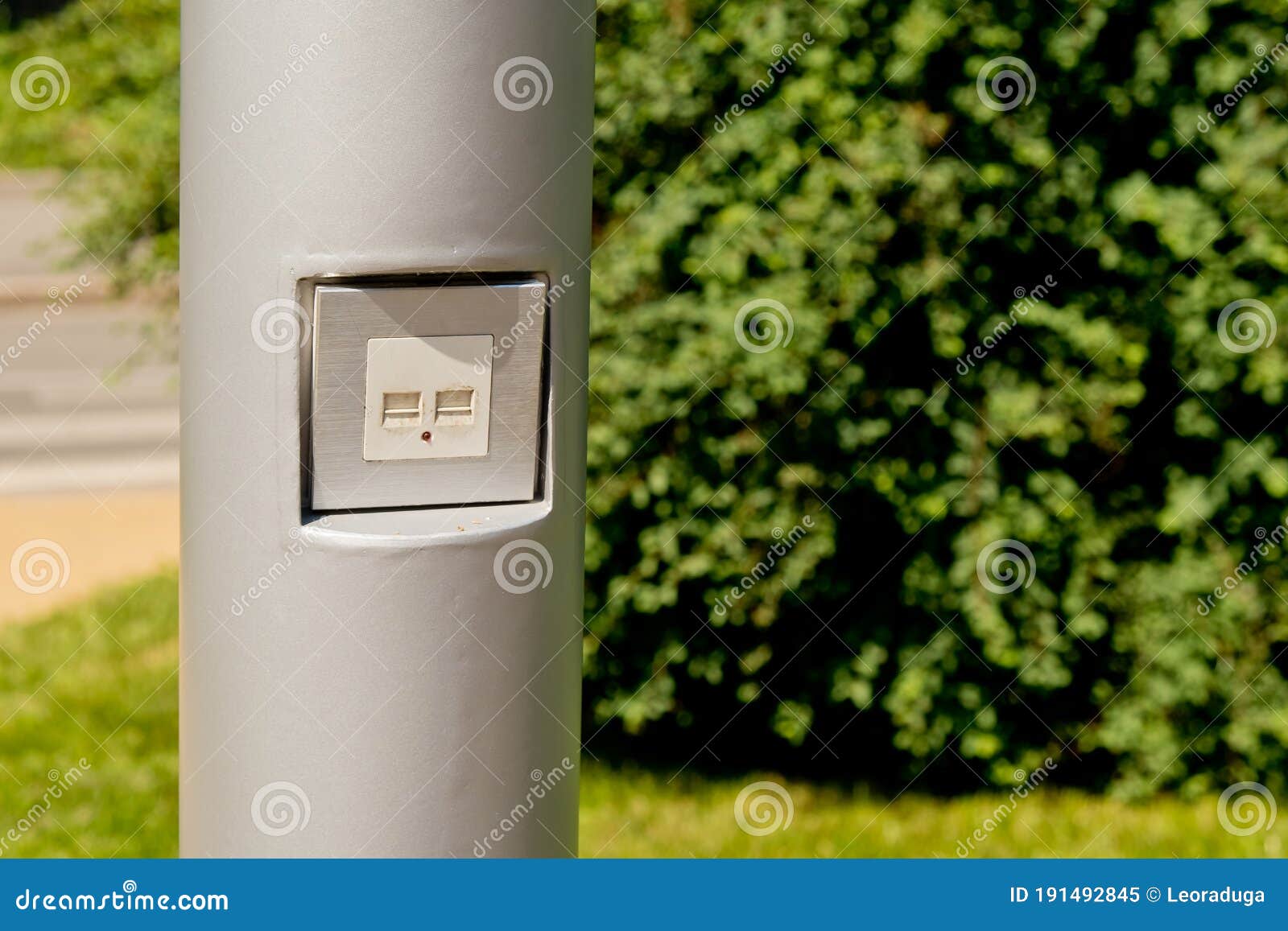USB Socket for Charging Mobile Phones on a Pole in the Park. Stock ...