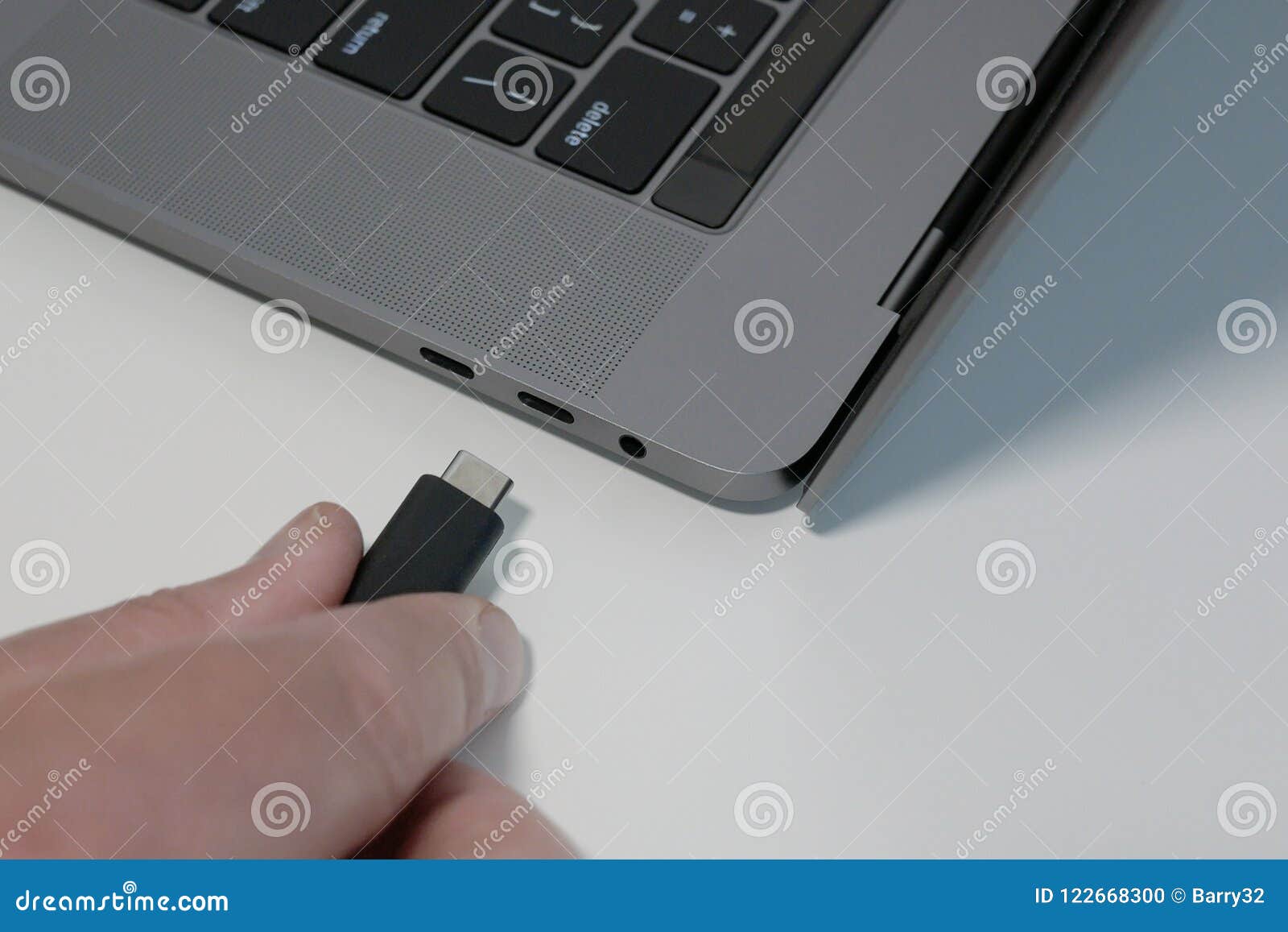 A USB Type C / USB-C Cable Being Plugged into a Modern Notebook ...