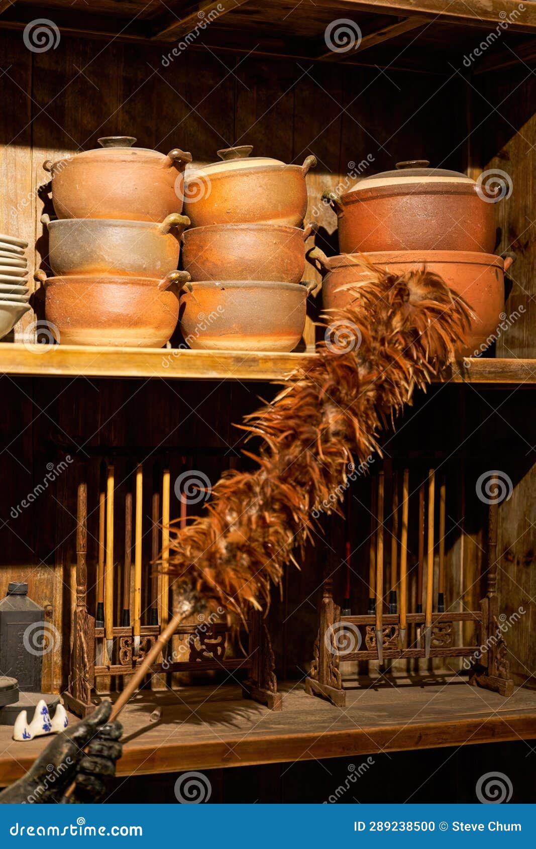 Use a Feather Duster To Clean Clay Jars Stock Photo - Image of plant ...