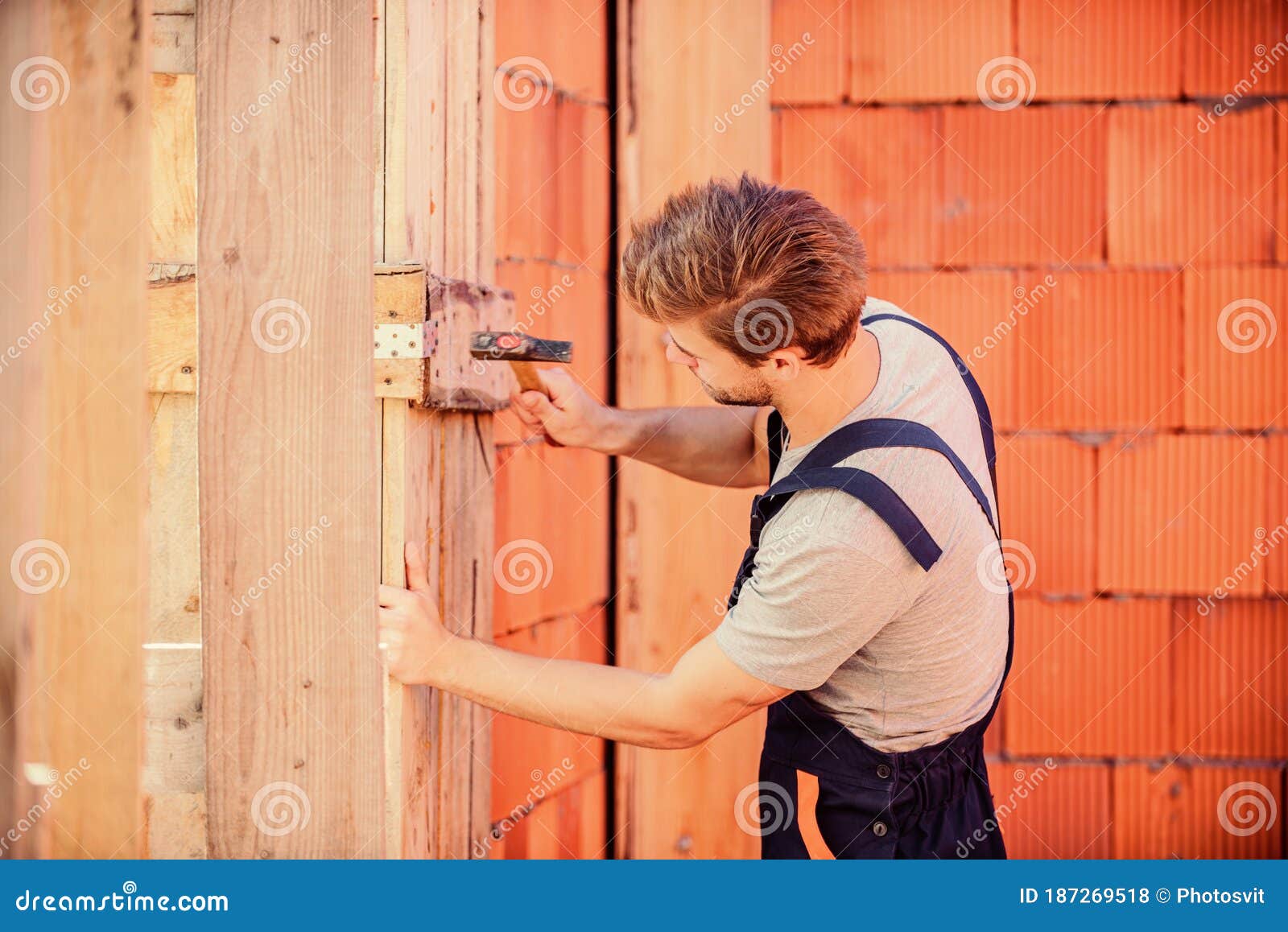 Use Hammer. Worker with Hammer Brick Wall Background. Building and ...