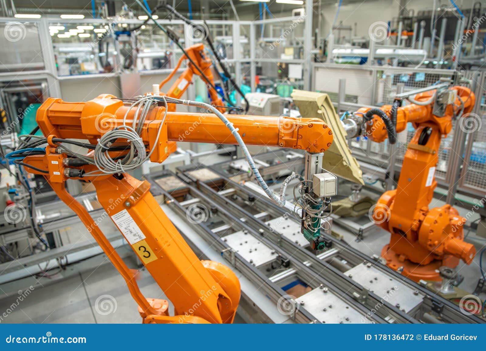 The Use of Robot Arms in Intelligent Industrial Factories Stock Photo ...