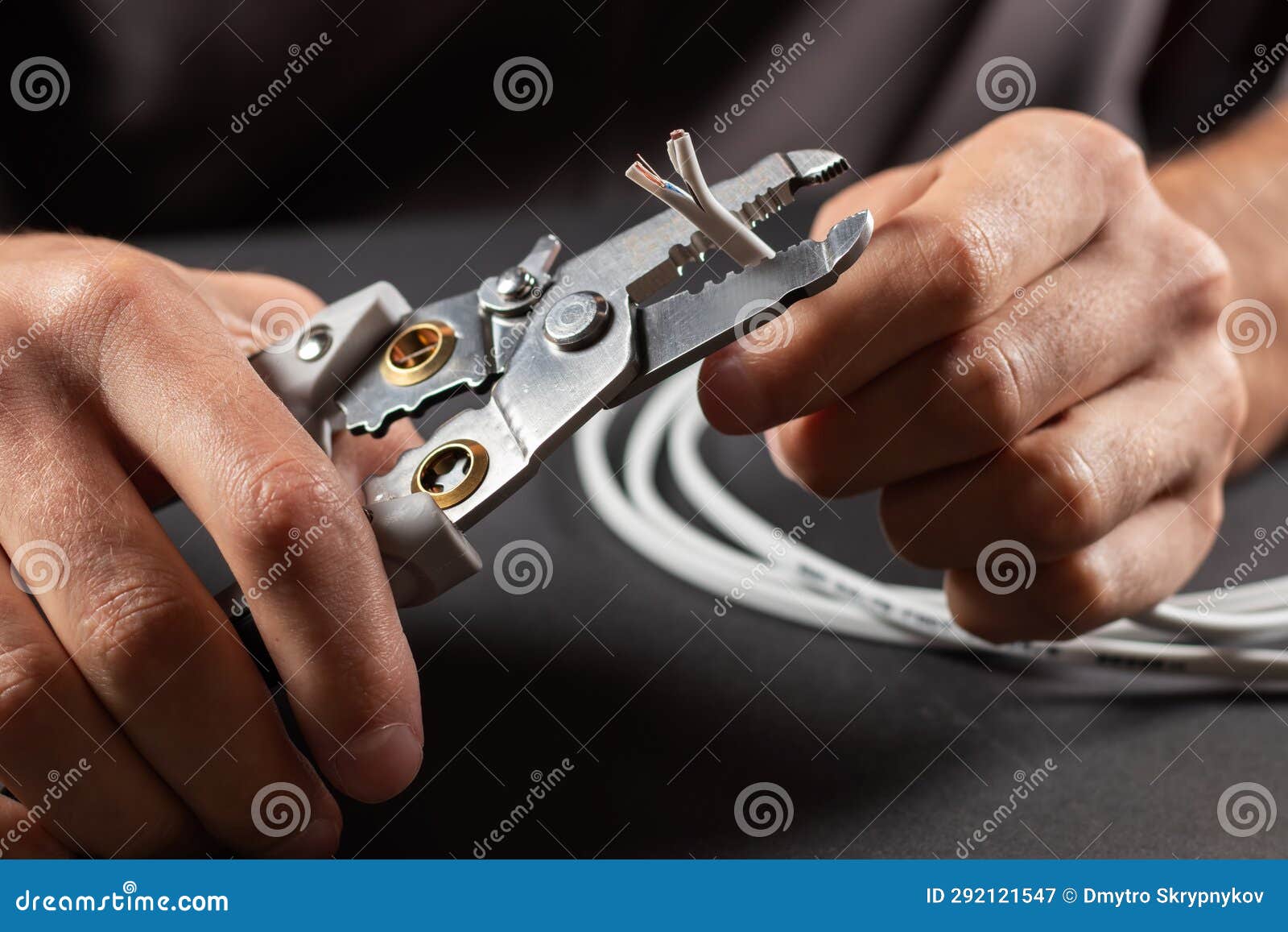 The Use of the Stripper Cutter Tool To Strip the End of the Electrical ...