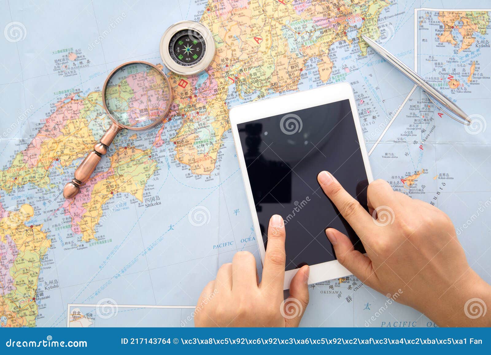 Use an Tablet To Check Japan Travel Plans on the Map of Japan Stock ...