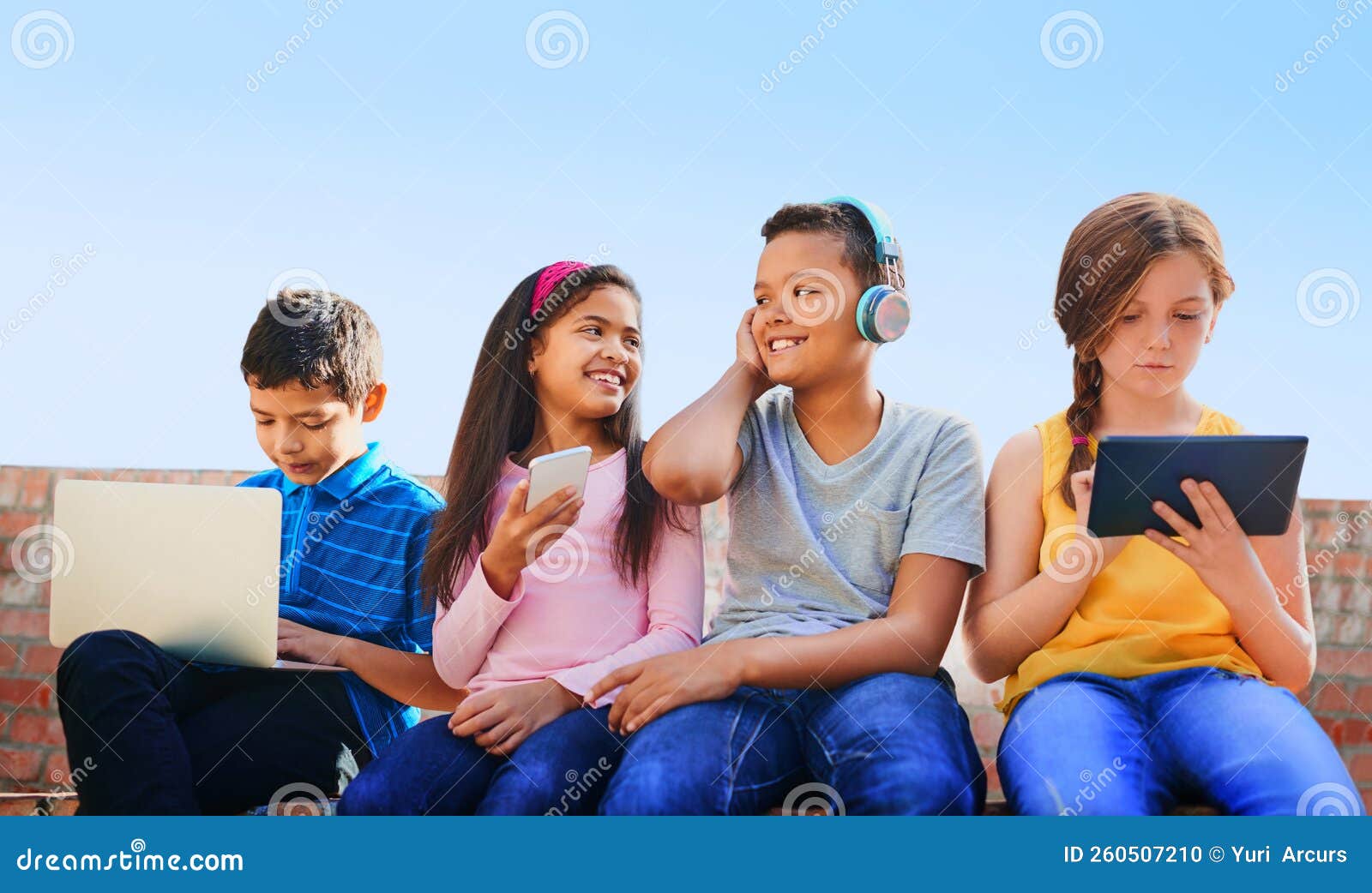 We Use Technology in a Fun Way. a Diverse Group of Children Having Fun ...