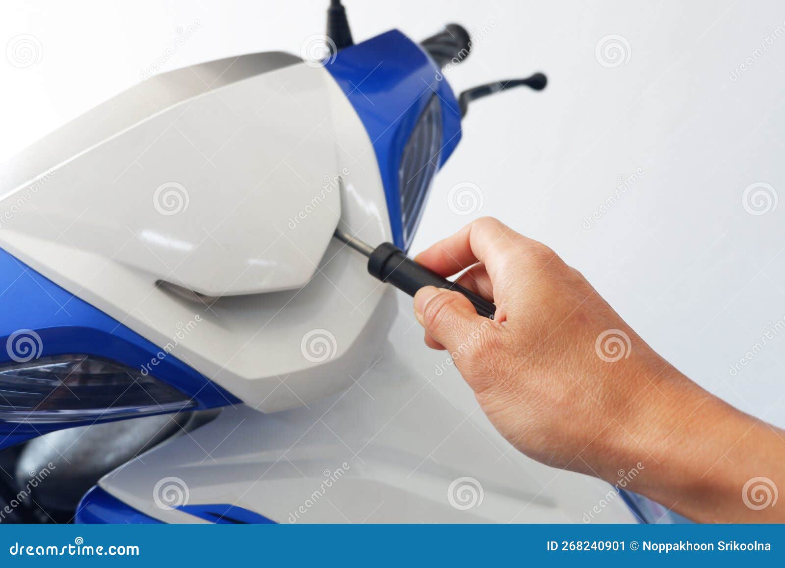 Use Your Hand To Hold a Screwdriver To Remove the To Open the ...