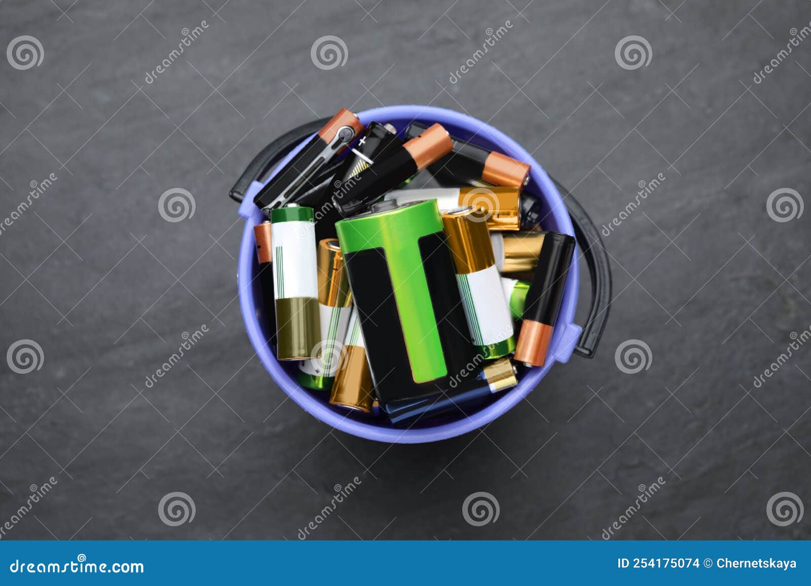 Used Batteries in Bucket on Black Table, Top View Stock Photo - Image ...