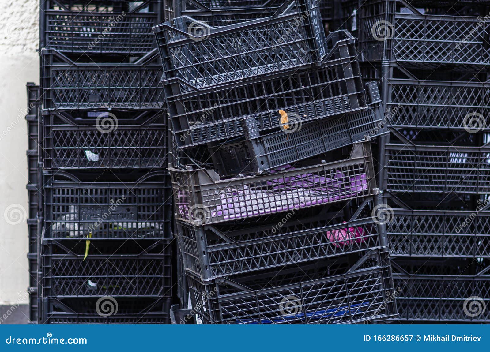 Piles of Black Plastic Boxes for Fruits and Vegetables. Stock Image ...