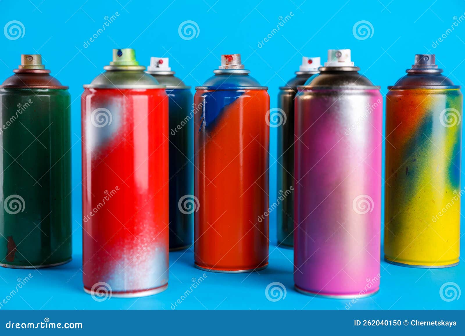 Used Cans of Spray Paints on Light Blue Background Stock Photo - Image ...