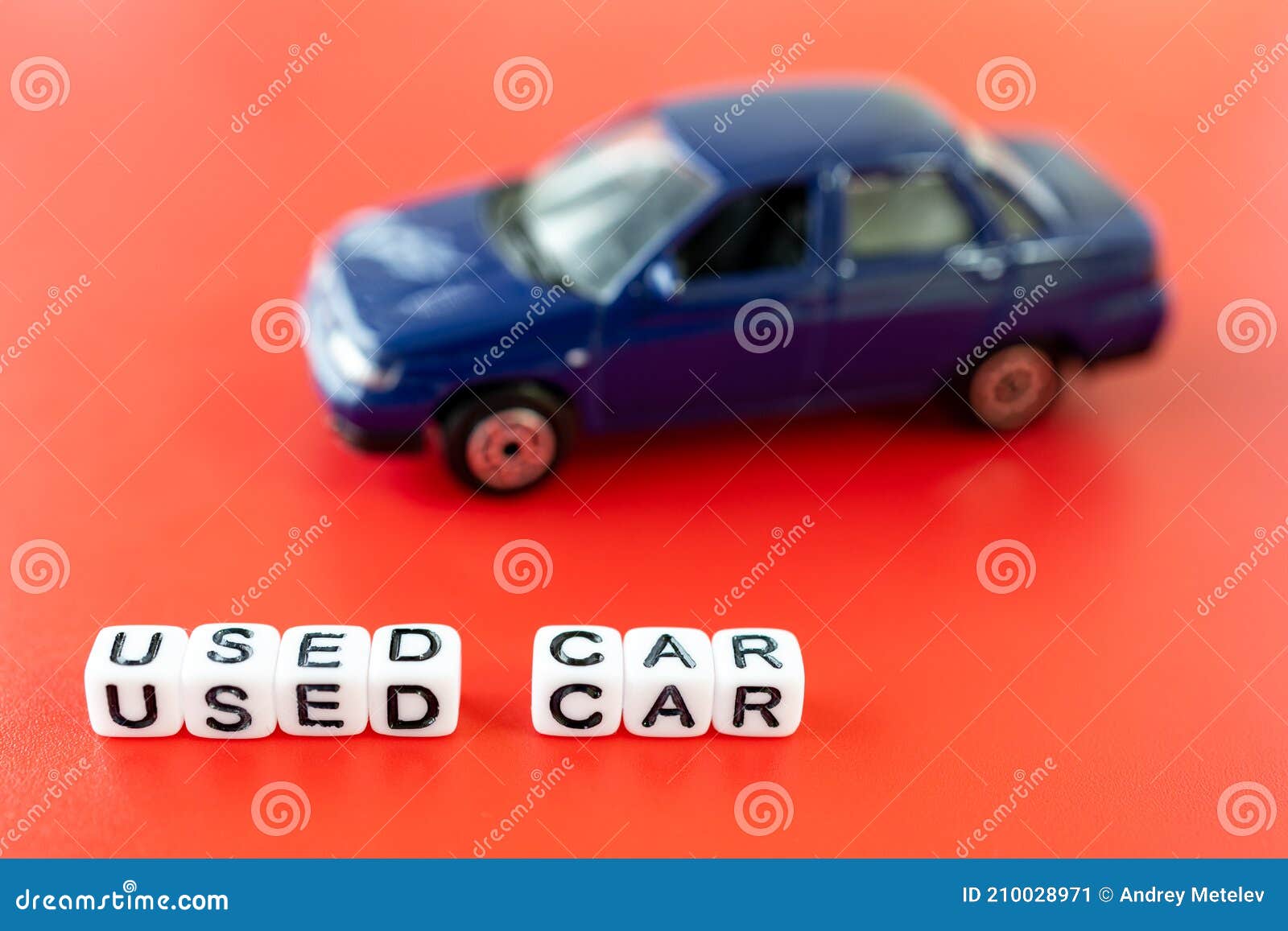 Used Car Lettering on Cubes, in the Background a Blue Car Stock Image ...