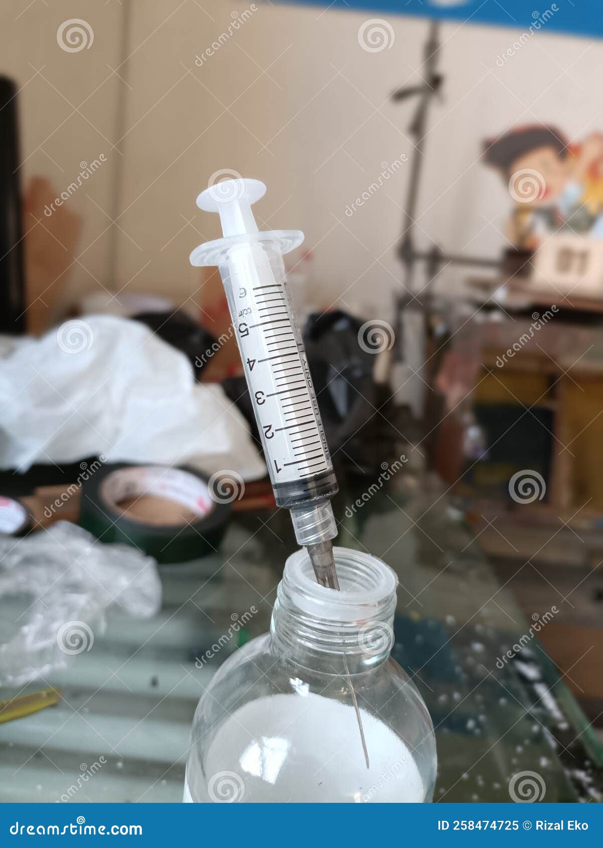 The Used 5 Cc Injection is Stuck in the Medicine Bottle Stock Image ...