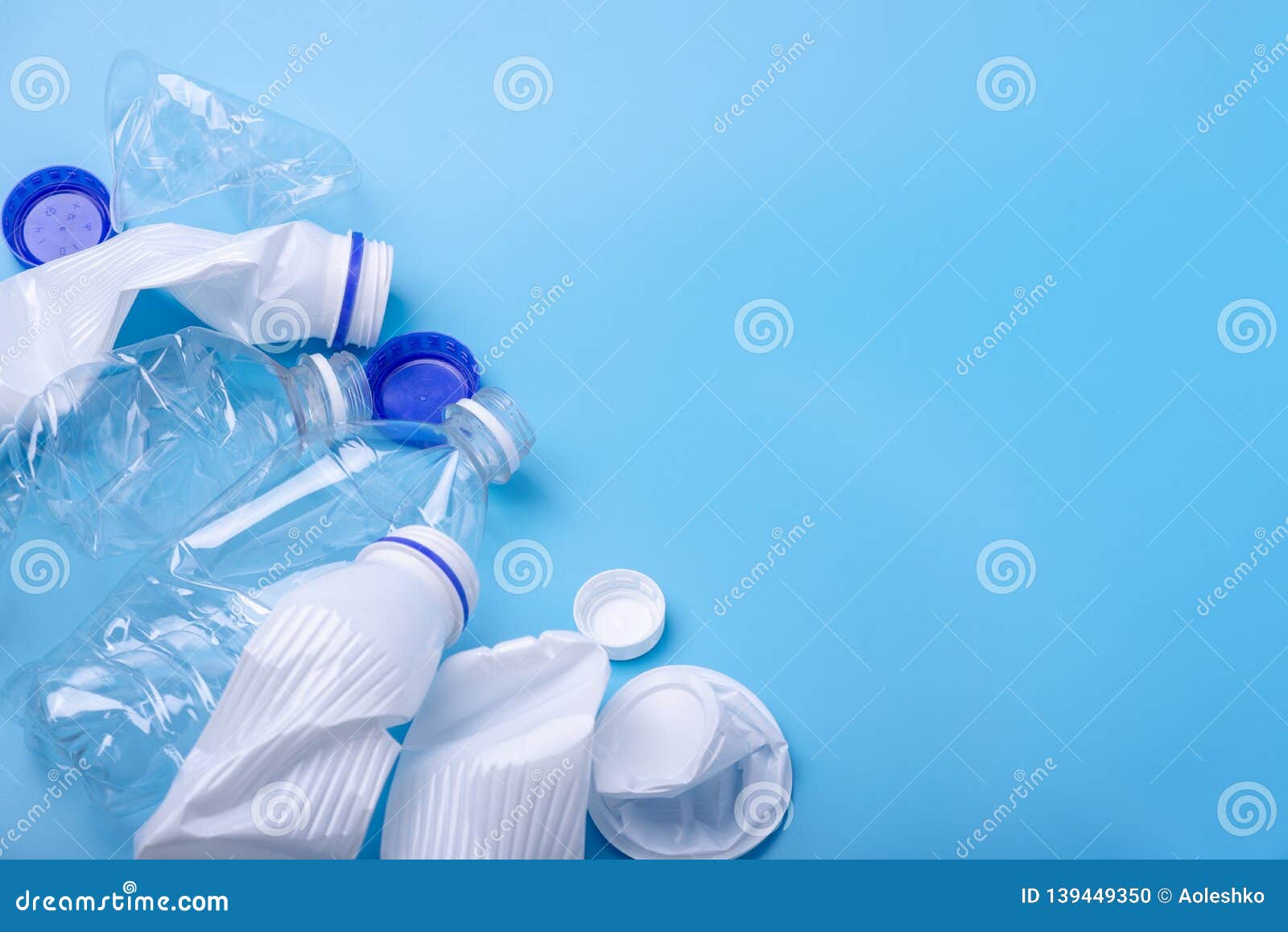 Used Clean Plastic Garbage In A Pile. Bottles On Blue Background ...