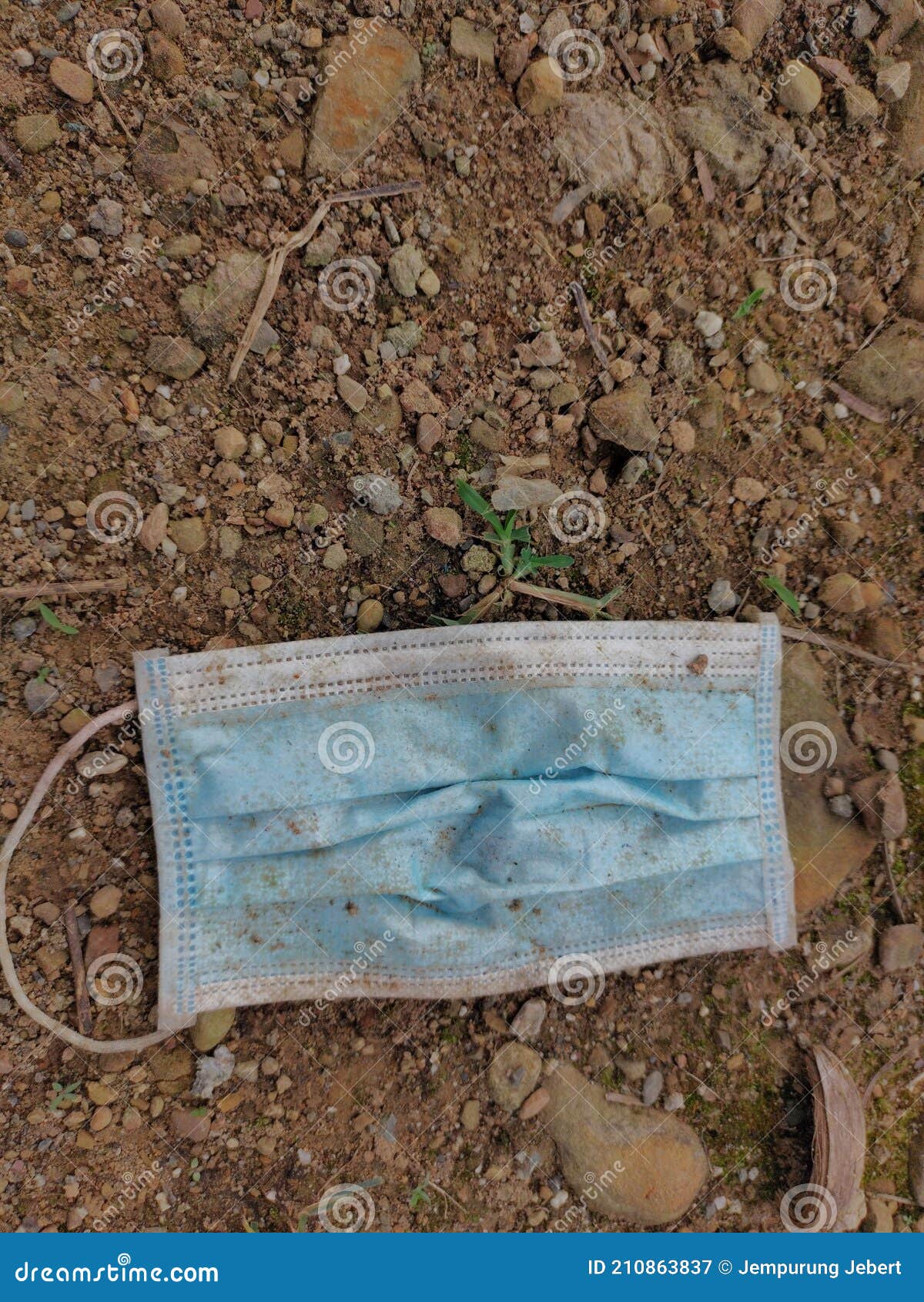 Used Discarded Mask on the Ground Stock Image - Image of sculpture ...